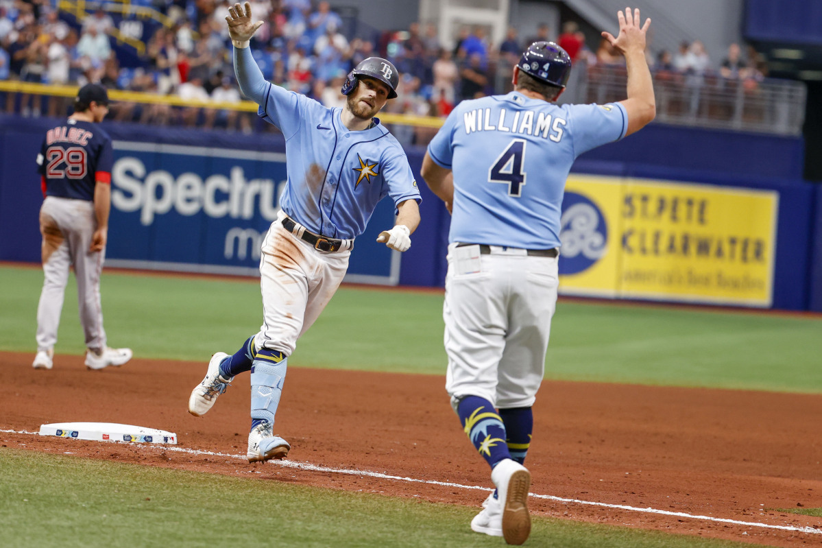 ivy ceballo times brandon lowe gets ready to high five third base coach ...