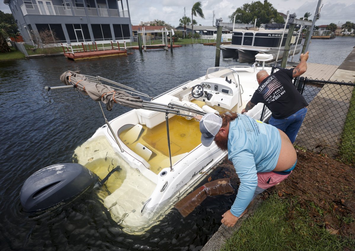 chris urso times juston keller and brian mccarty both of hudson work to ...