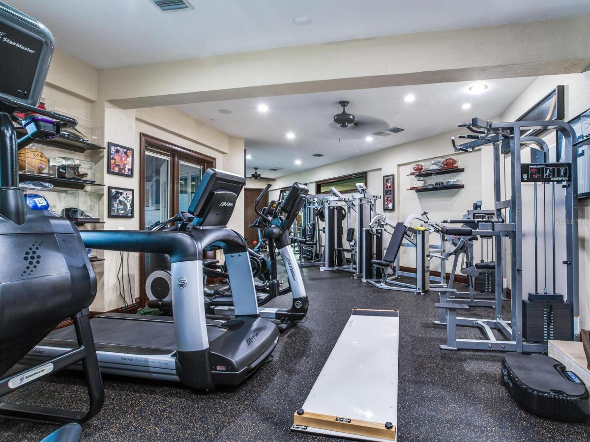 a portion of the home gym on the ground floor of the family s former home