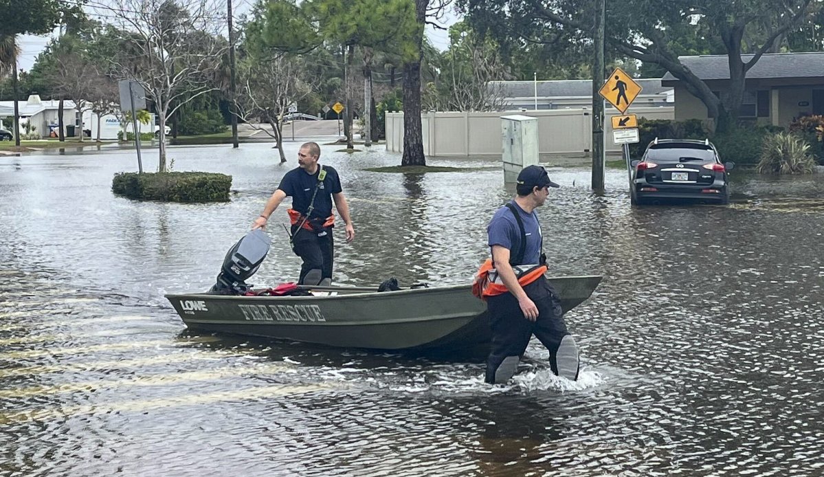 max chesnes times firefighters with st pete fire rescue walk in water ...