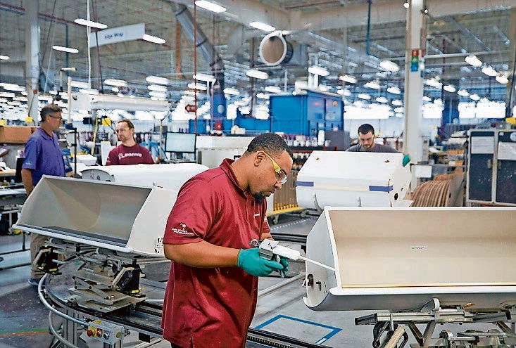 Boeing workers build parts for overhead bins at the Interiors ...