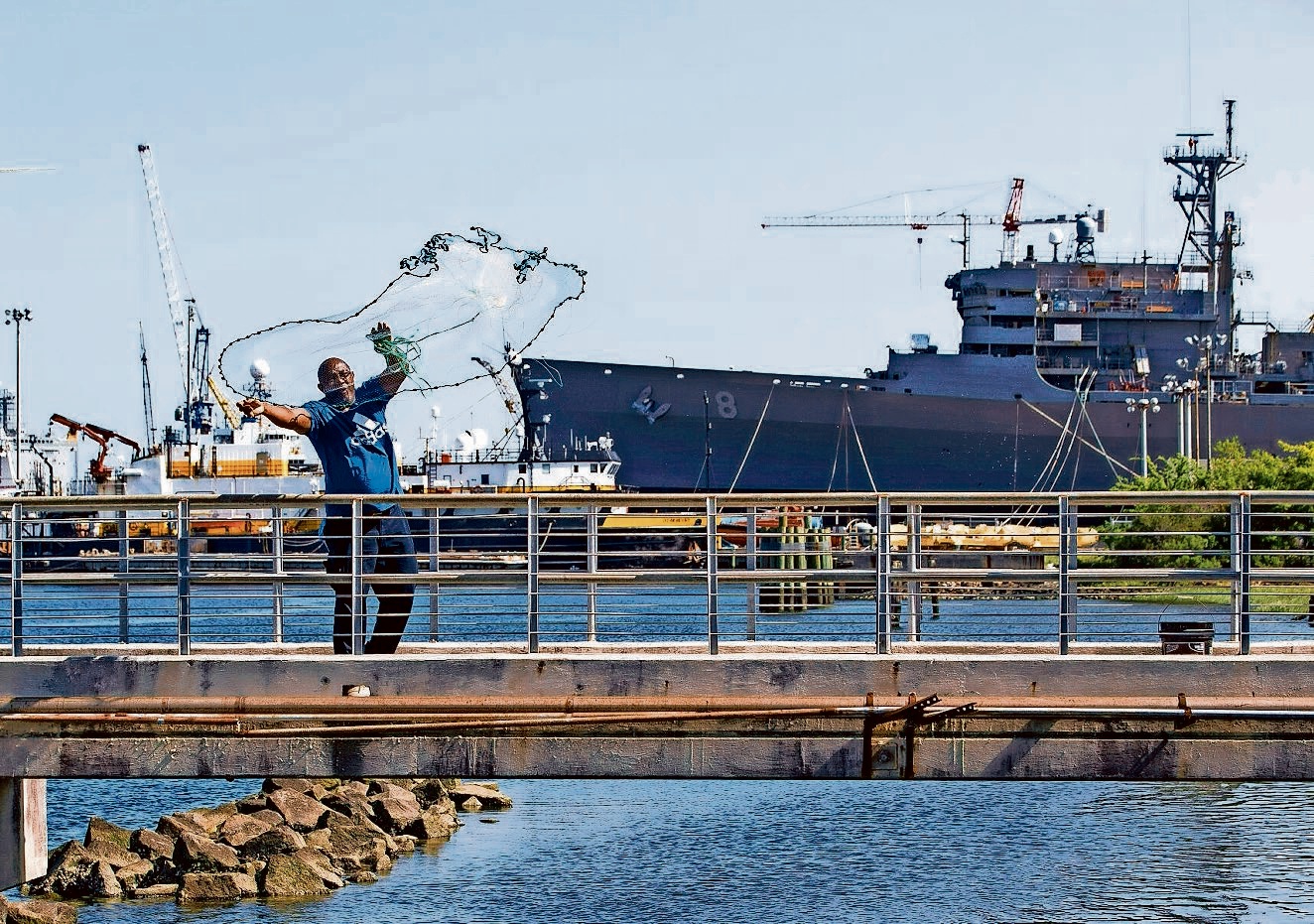 file andrew j whitaker staff donald bellamy casts his net along the ...