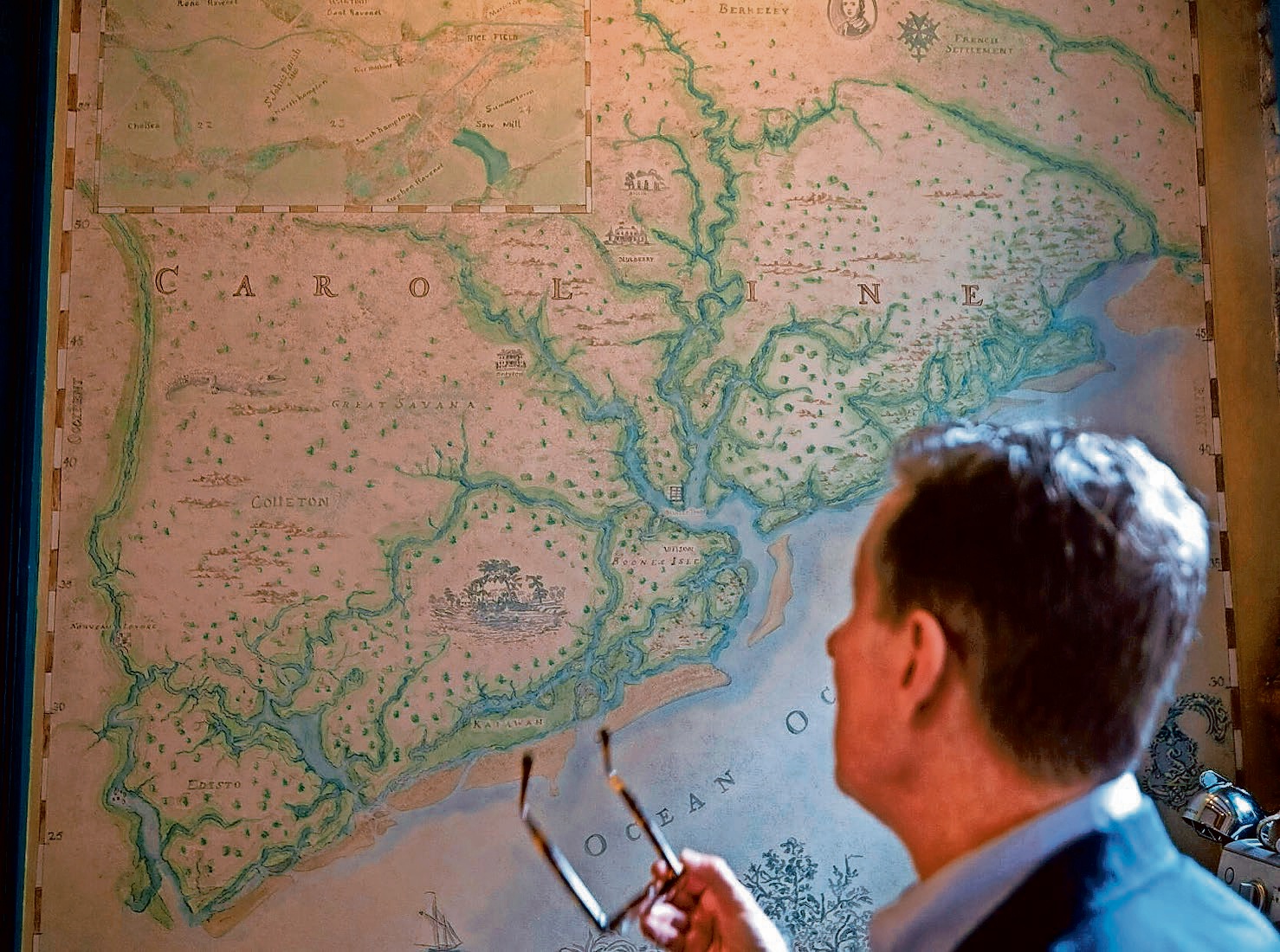 PHOTOGRAPHS BY HENRY TAYLOR/STAFF Rick Wilson looks over a version of ...