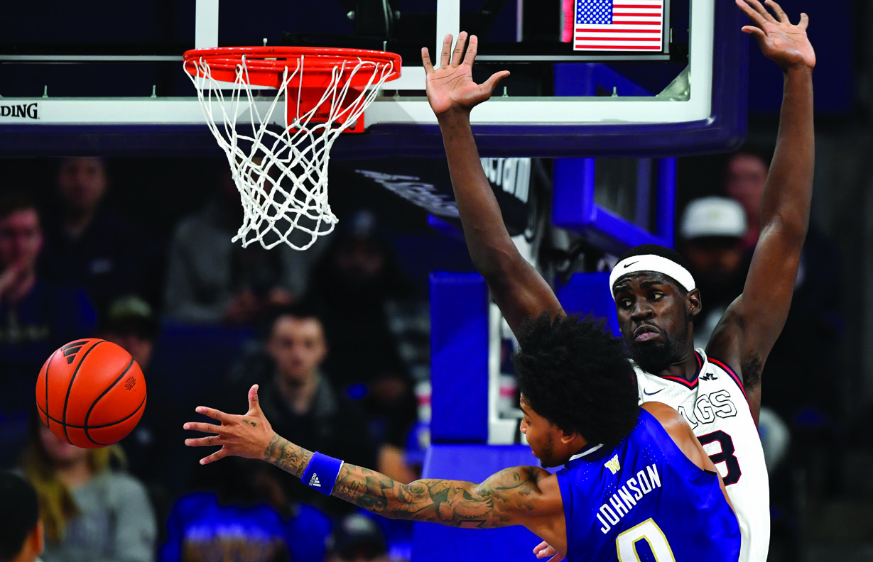 TYLER TJOMSLAND/THE SPOKESMAN-REVIEW Washington Huskies’ Koren Johnson ...