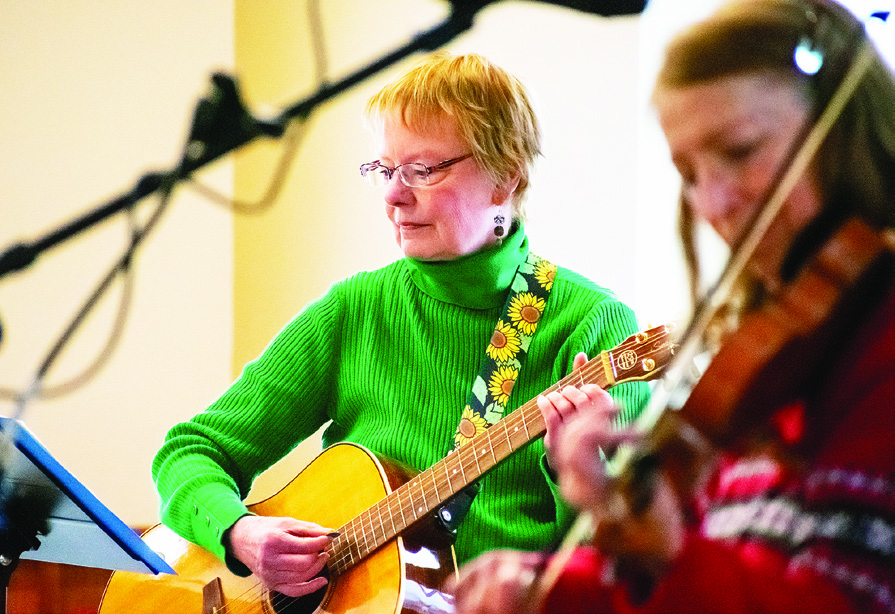Susan Irvin, 72, plays the guitar just before her first fiddle ...